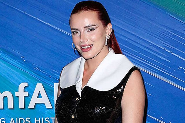 Bella Thorne Wears Nothing But An Open Velvet Vest & Matching Pants In ...